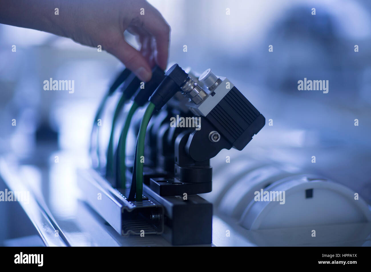 Hand operating sensoric device Stock Photo - Alamy