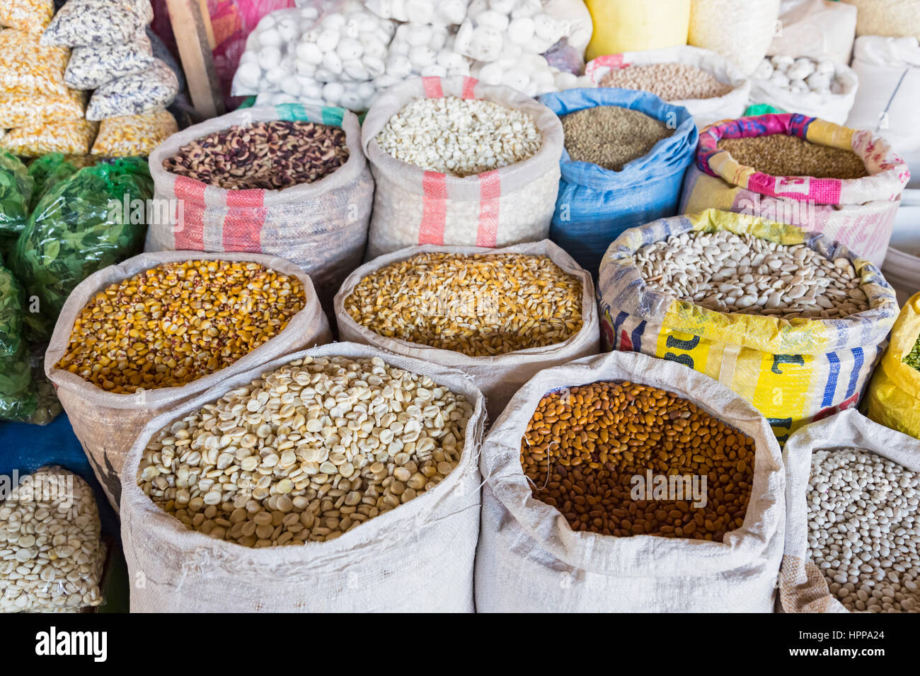 Peru, Cusco, market Mercado Central de San Pedro, sacks with cereals ...