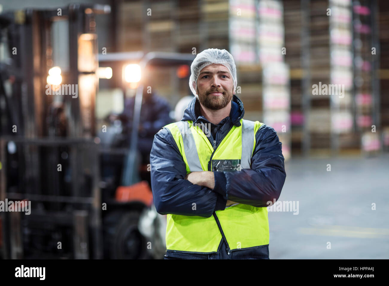 Portrait of confident warehouseman Stock Photo - Alamy