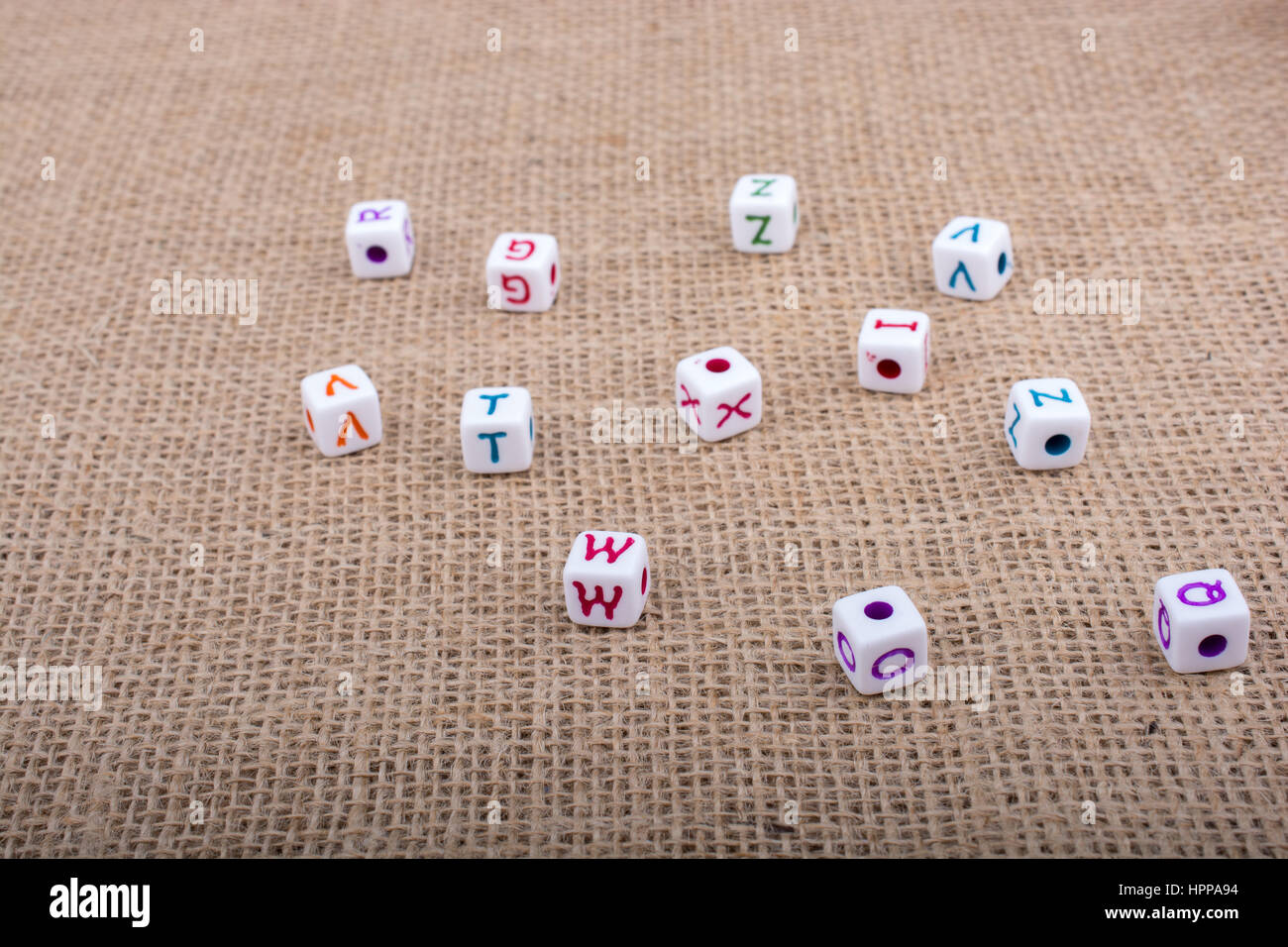 Colorful alphabet letter cubes on a linen canvas Stock Photo - Alamy