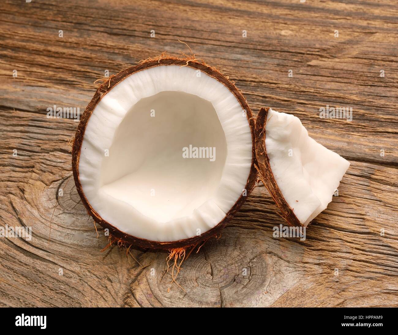 Fresh organic coconut on rustic wooden background Stock Photo - Alamy