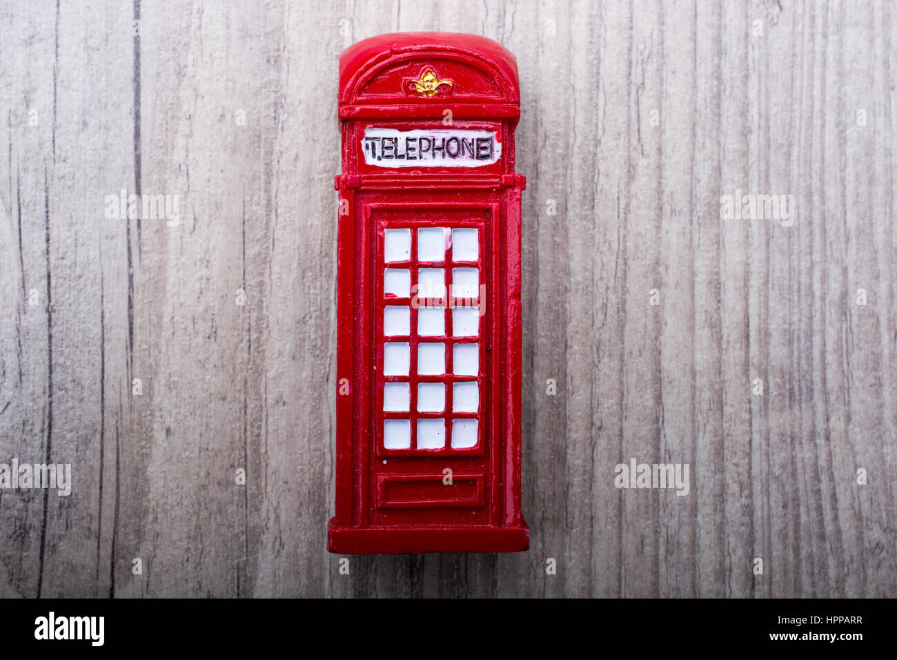Red telepphone booth on a grey background Stock Photo - Alamy