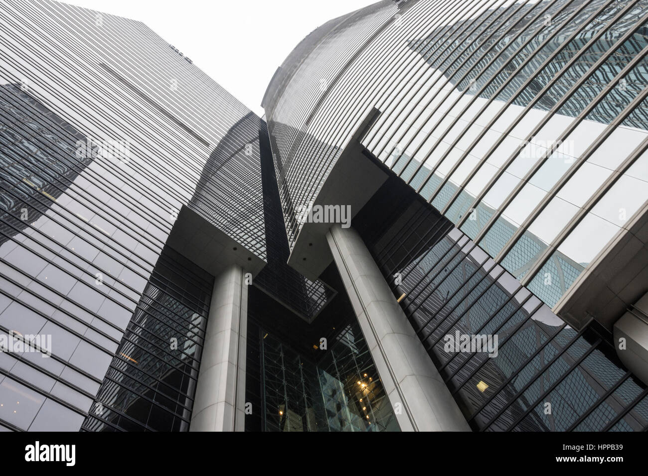 a view of a skyscraper from below in Hong Kong Stock Photo - Alamy