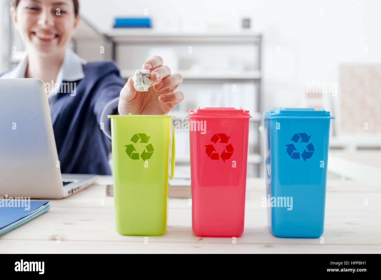 Waste separate collection and recycling in the workplace, office worker ...