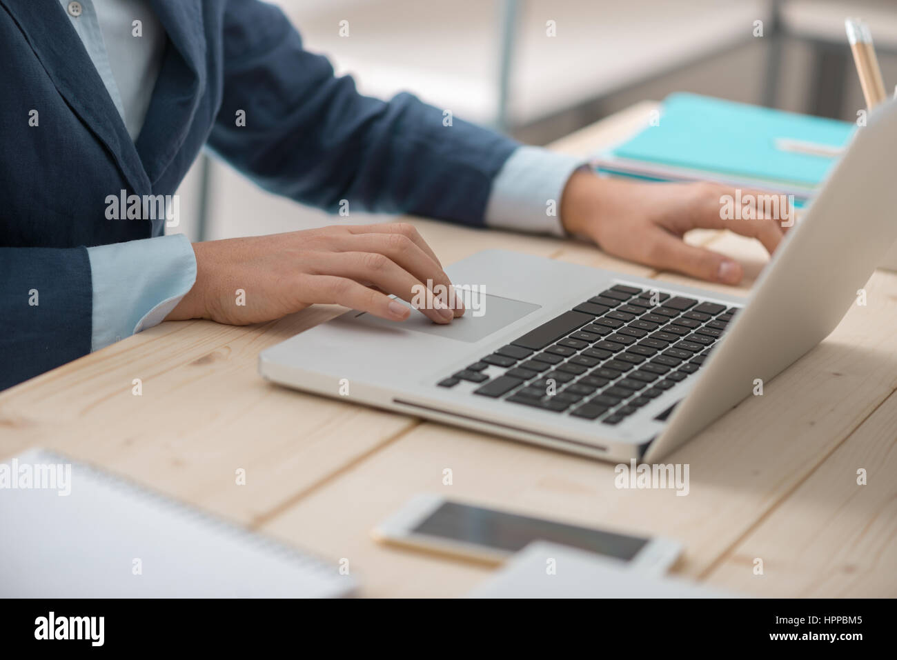 Professional businesswoman at work, connecting with a laptop and ...