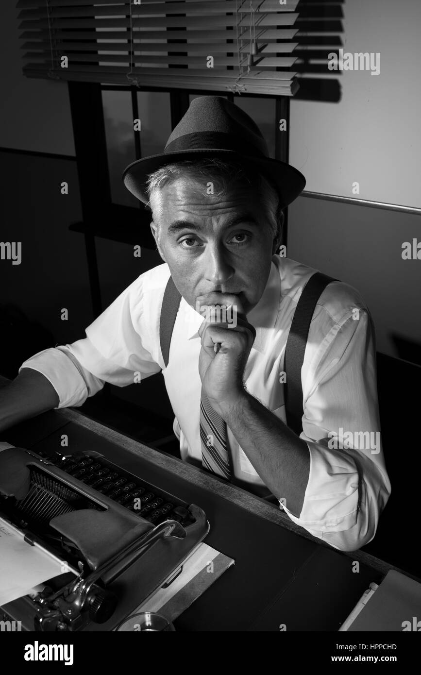 Professional reporter thinking and looking at camera with vintage ...