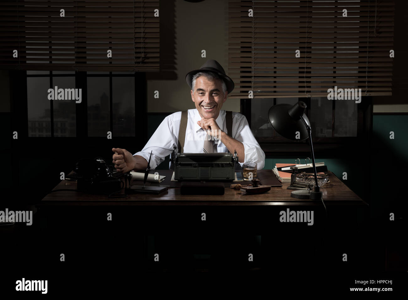 Journalist looking at camera confidence sitting typewriter hi-res stock ...