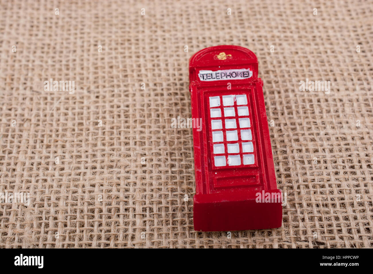 Red color phone booth on a canvas background Stock Photo - Alamy