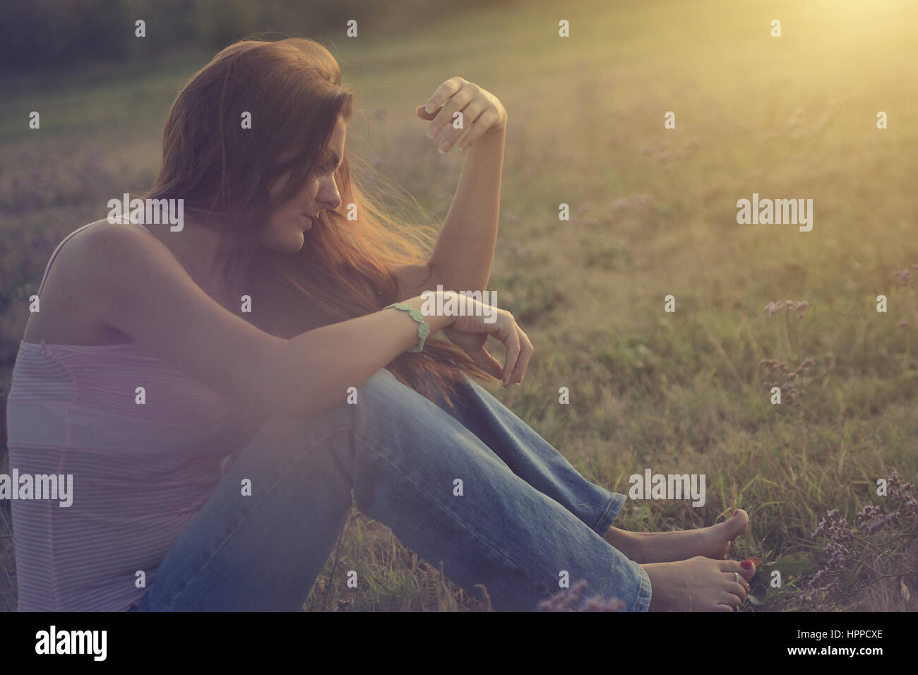 Sad woman in the nature Stock Photo - Alamy