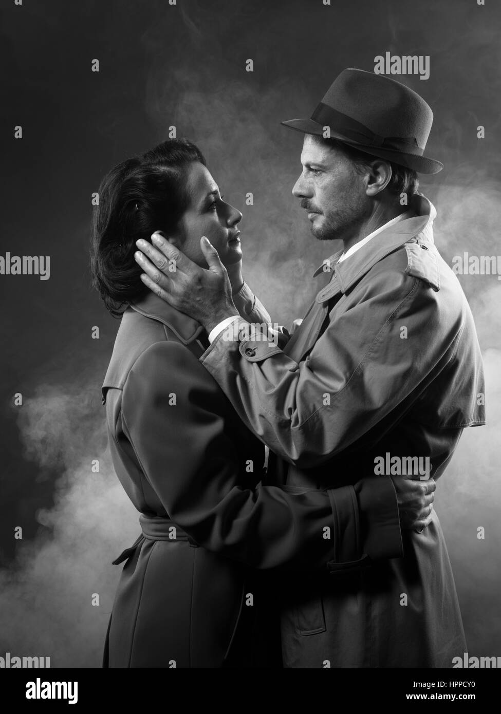 Film noir: romantic loving couple embracing in the dark, 1950s style ...