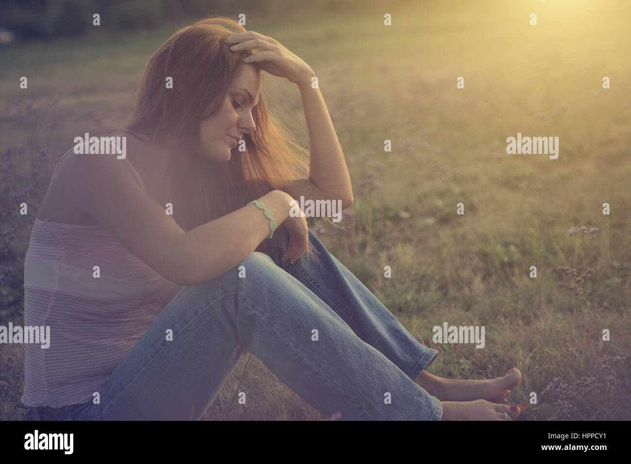 Sad woman in the nature Stock Photo - Alamy