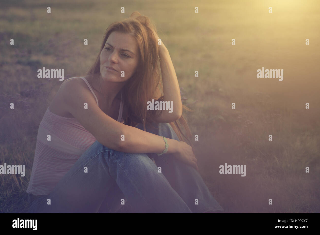 Sad woman in the nature Stock Photo - Alamy