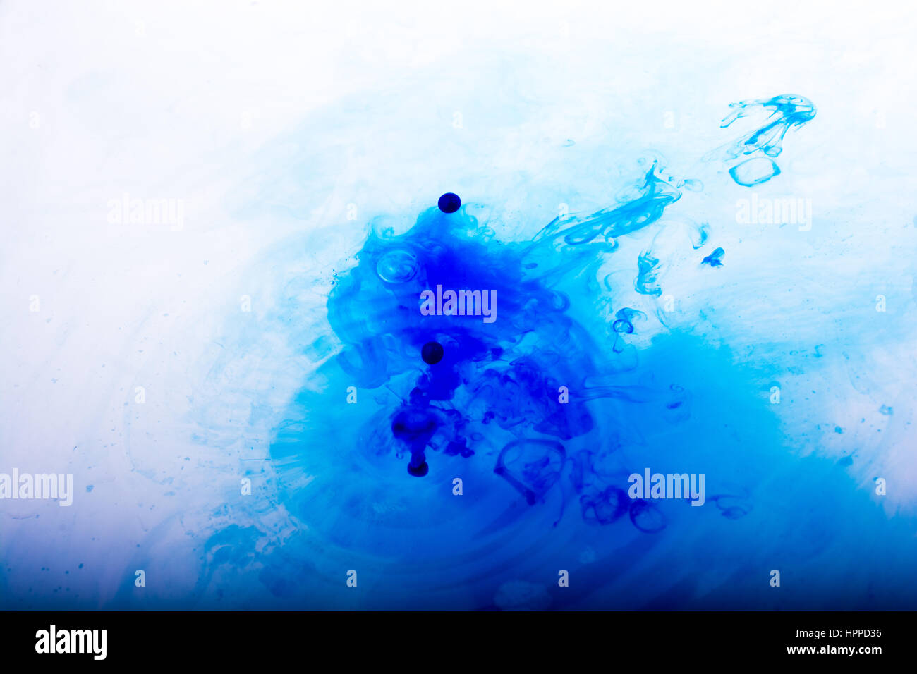 Watercolor paint dissolving in pure water Stock Photo - Alamy