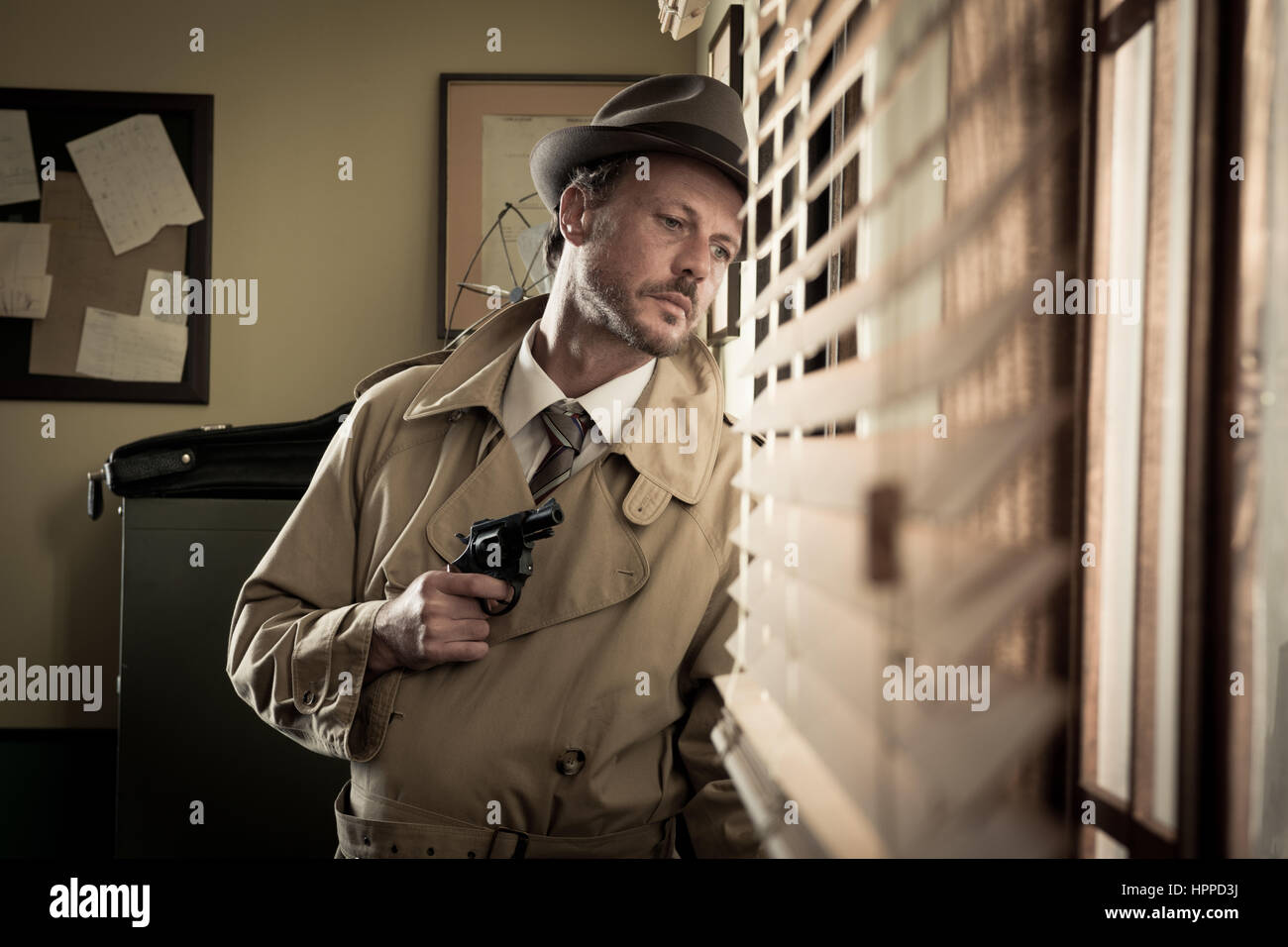Attractive spy agent peeking from an office window, film noir Stock ...
