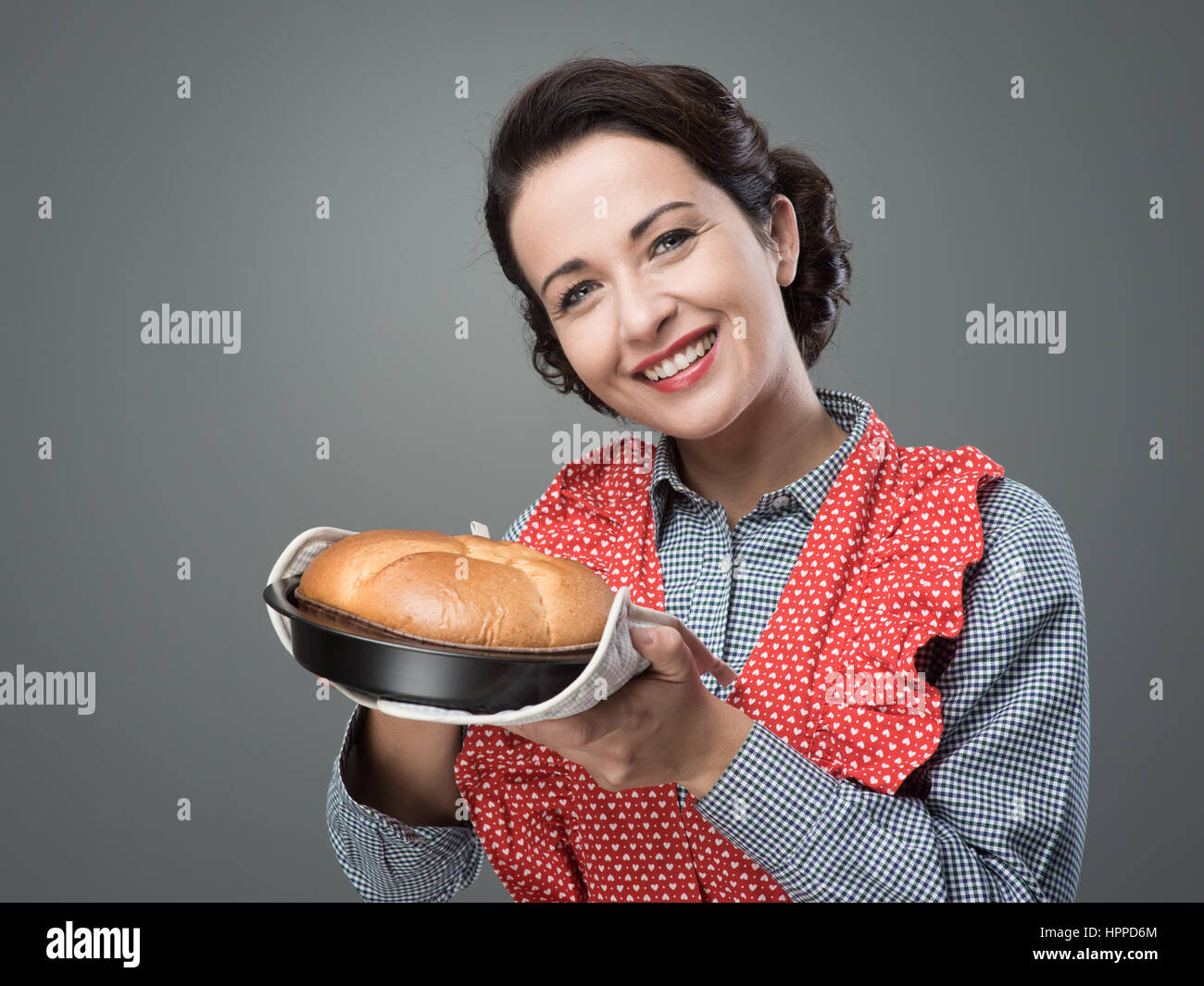 Woman holding cake 1960's hi-res stock photography and images - Alamy