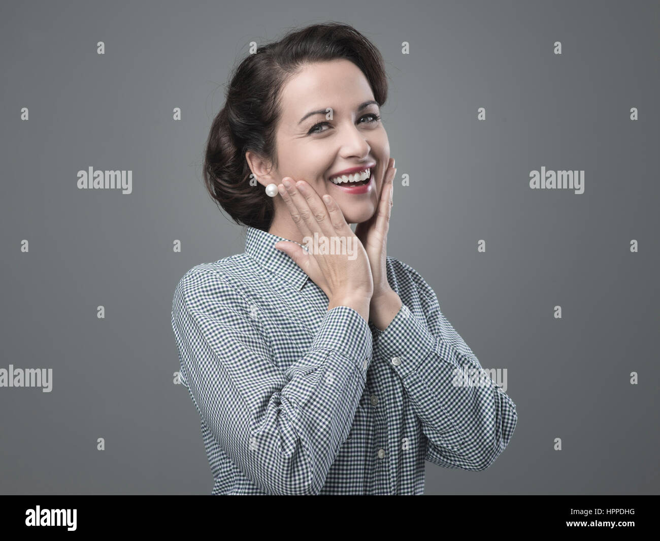 Cheerful 1950s woman feeling awesome and full of energy Stock Photo - Alamy