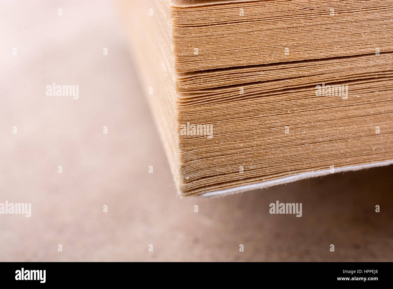 Book pages partly in view on white background Stock Photo - Alamy