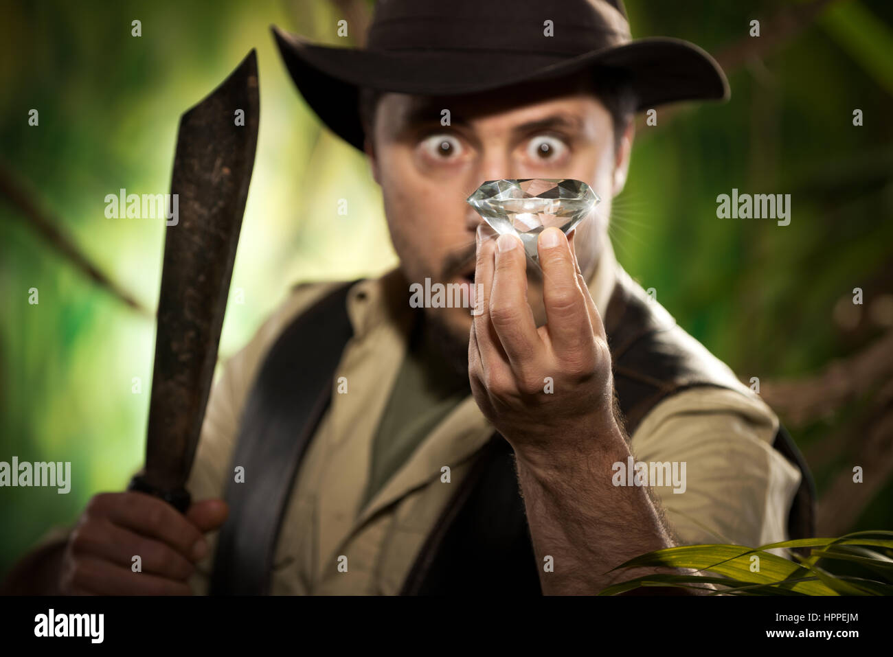 Surprised young explorer finding a huge precious diamond in the jungle ...