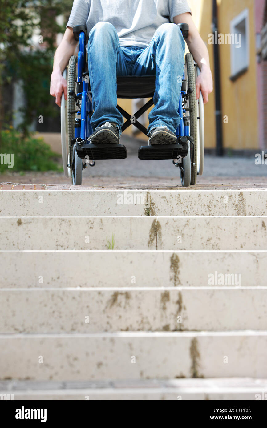 Wheelchair user in front of staircase Barrier Stock Photo - Alamy