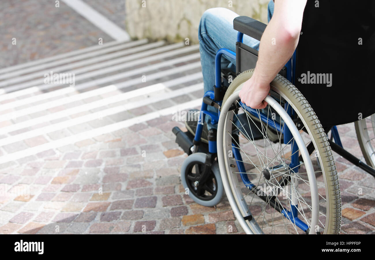 Wheelchair user in front of staircase Barrier Stock Photo - Alamy