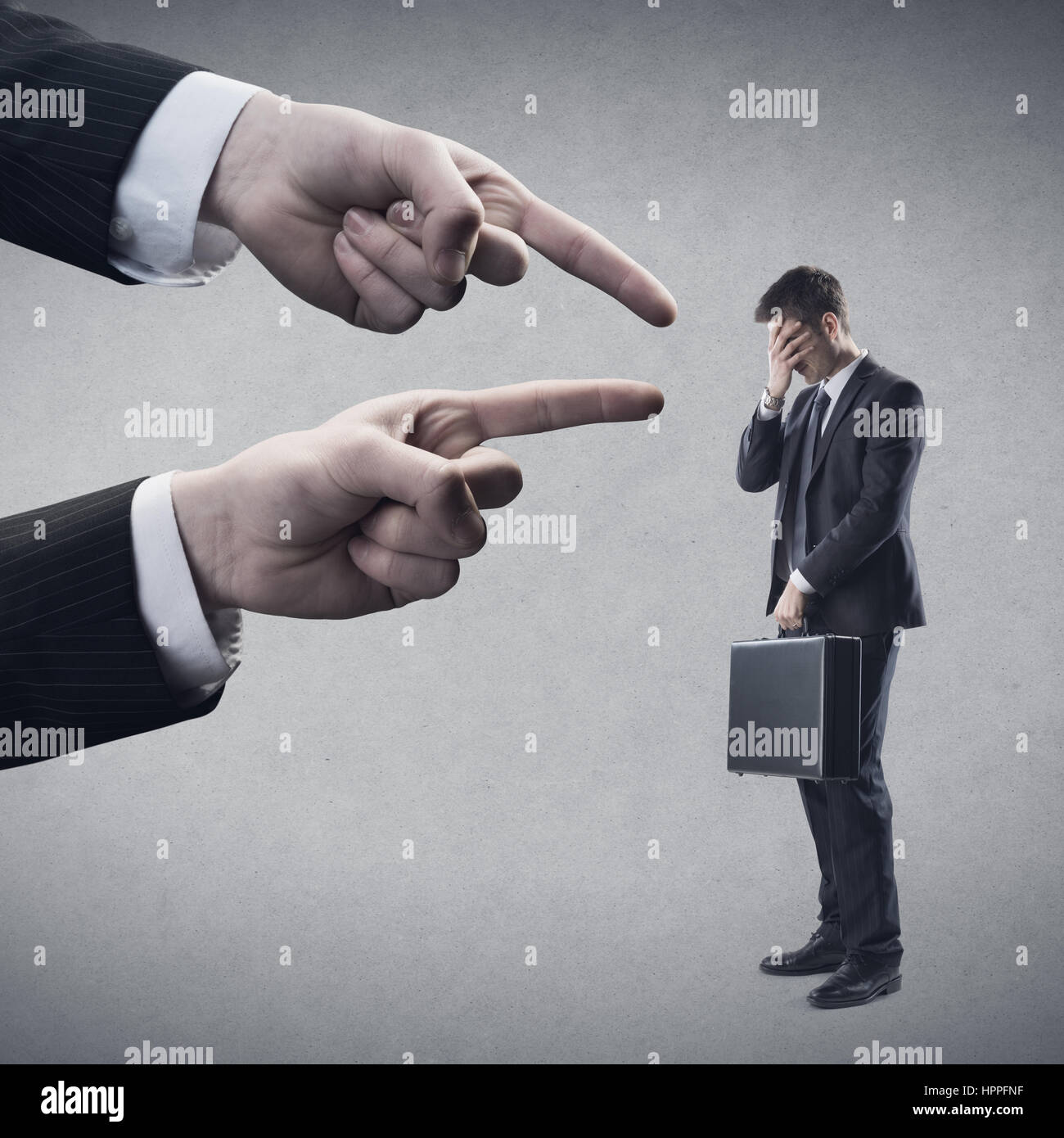 Fingers pointing at young employee Stock Photo - Alamy