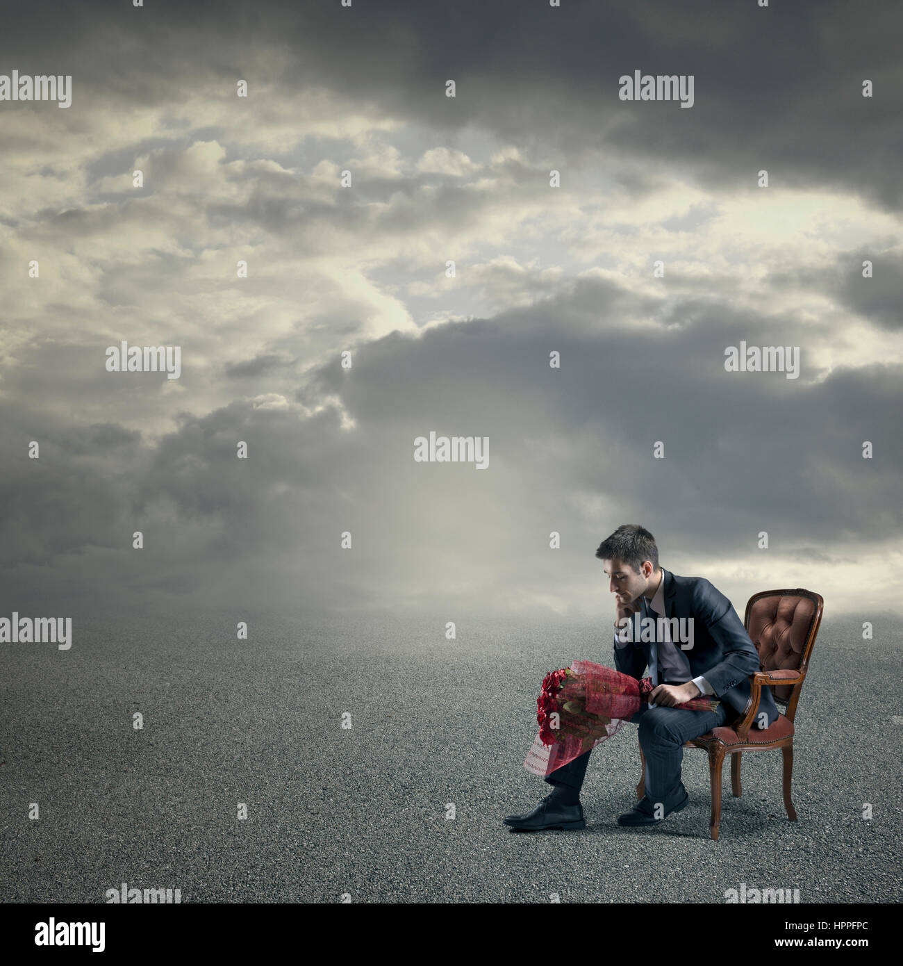 Elegant man waiting for a date with red roses Stock Photo - Alamy