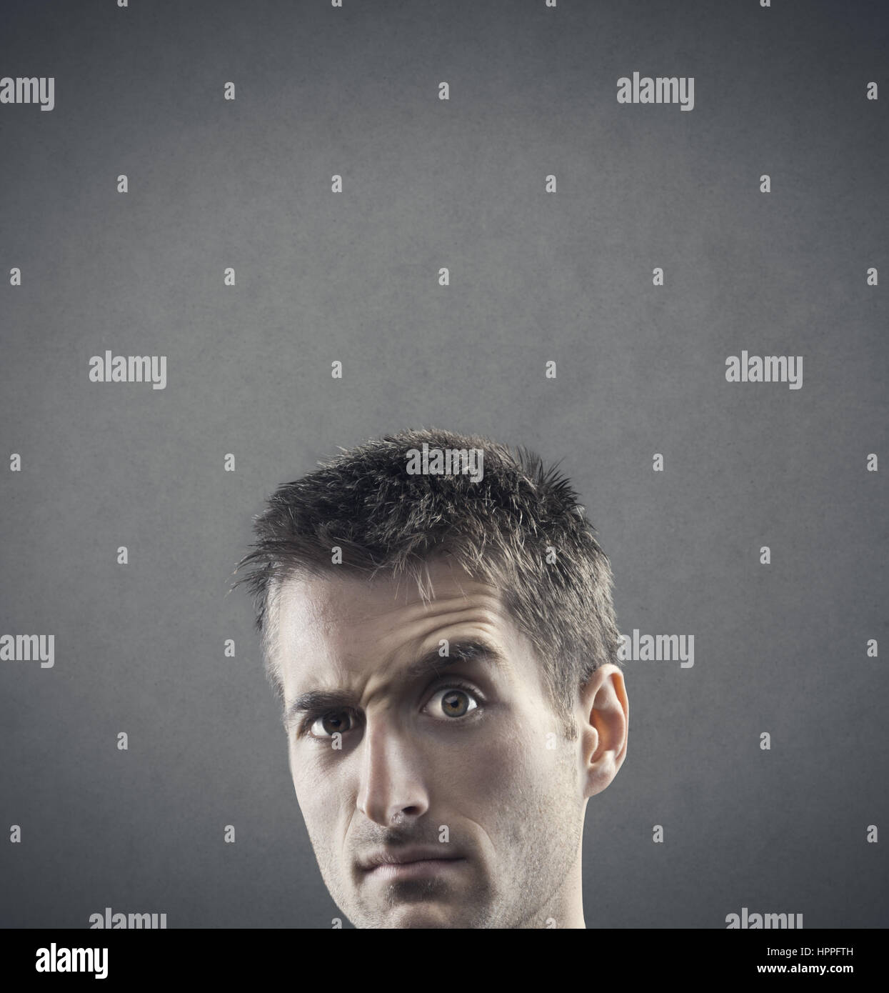 Facial expression: doubt and suspiciousness. copy space Stock Photo - Alamy
