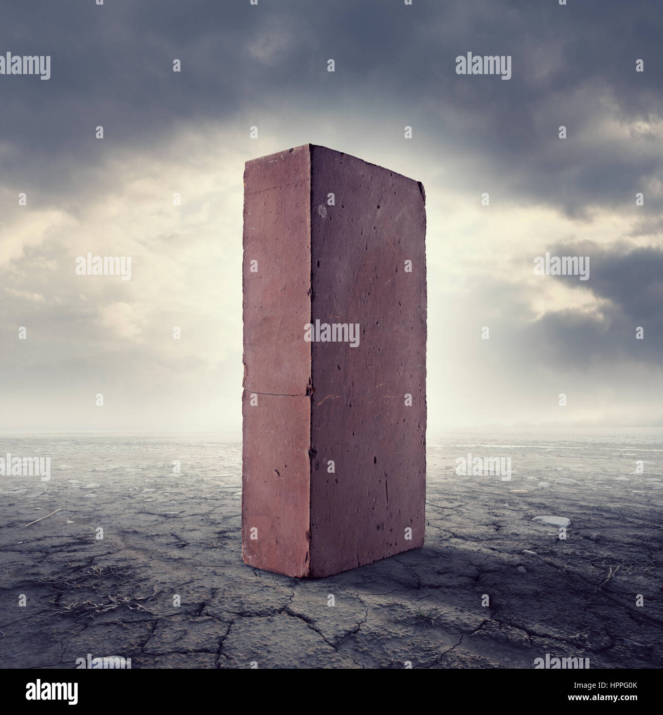 Brick standing in the middle of a desert land with cloudy sky on ...