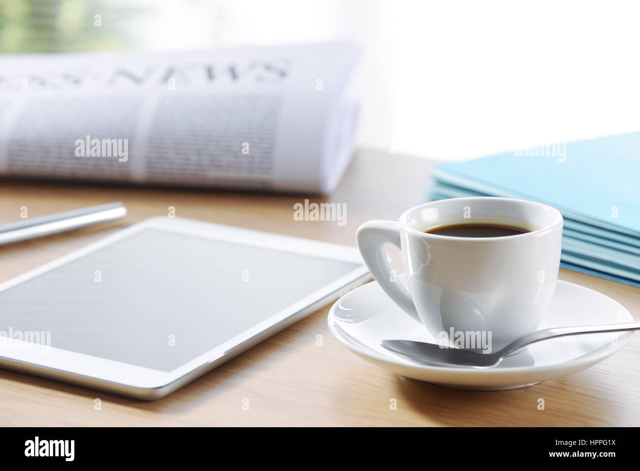 Business Office scene, digital tablet and newspaper with coffee Stock ...