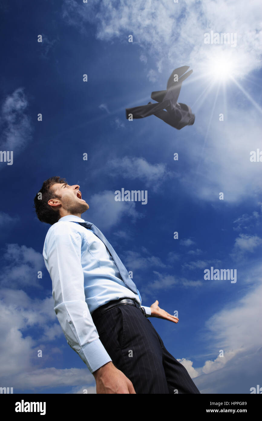 Young business man celebrating his success Stock Photo - Alamy