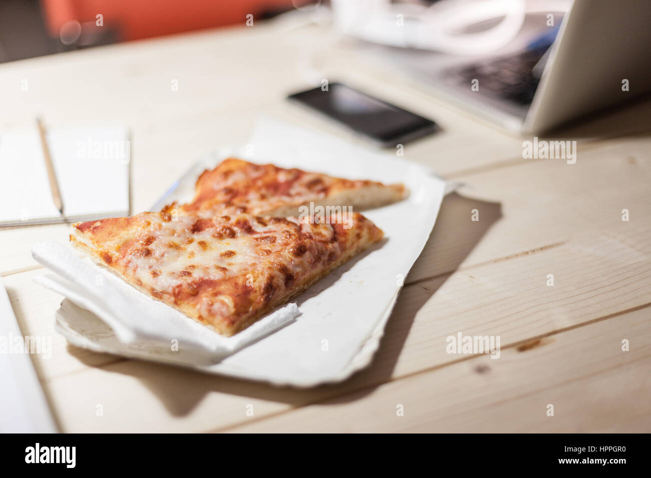 Office eating pizza slice desk hi-res stock photography and images - Alamy