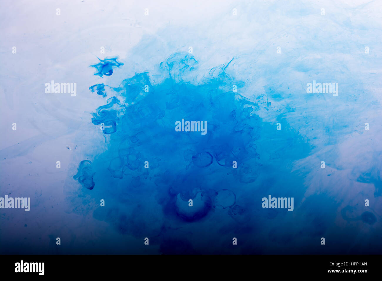 Watercolor paint dissolving in pure water Stock Photo - Alamy