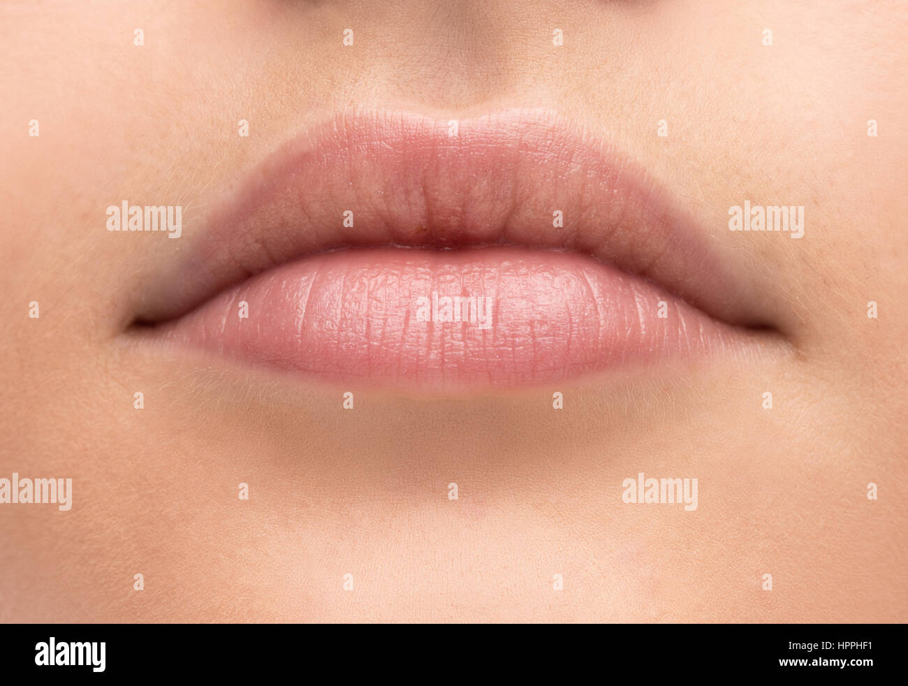 Beautiful young woman's full lips close-up, perfect skincare concept ...