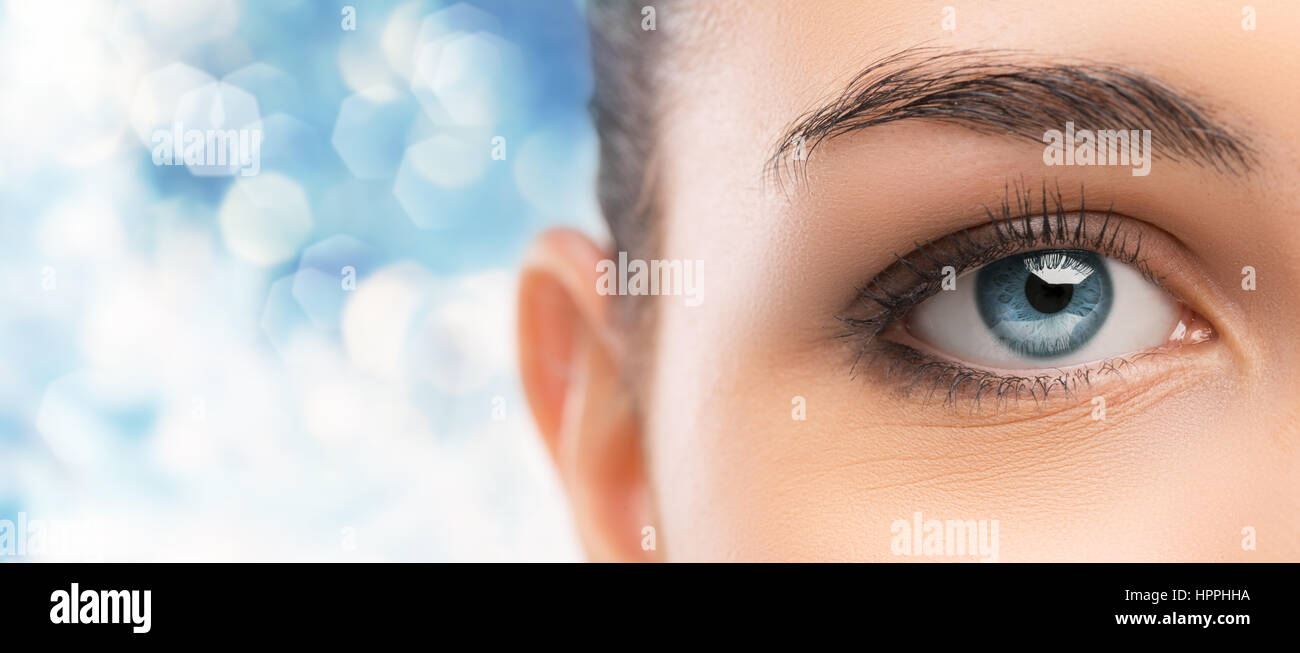 Beautiful woman's blue eye close up looking at camera Stock Photo - Alamy