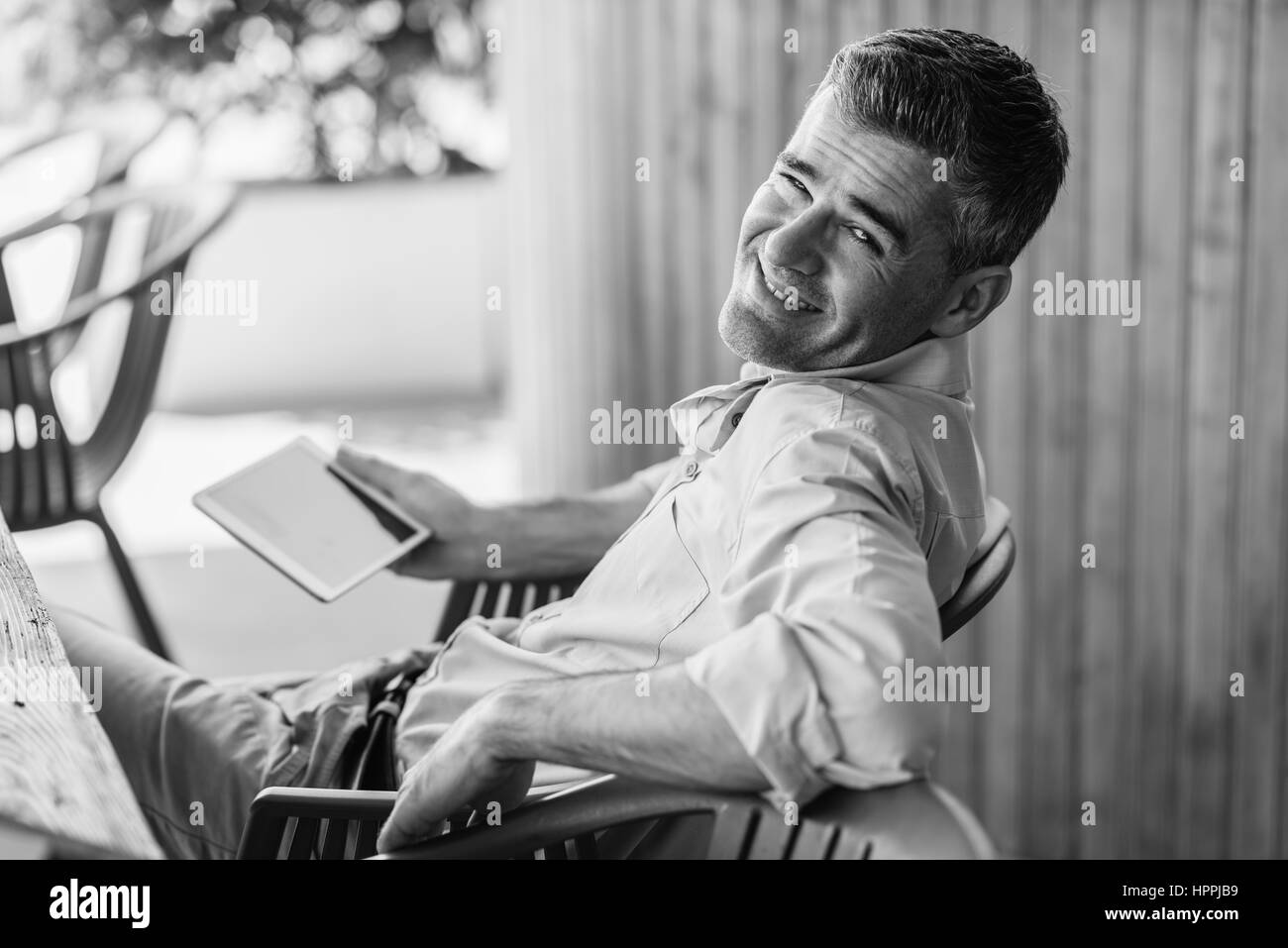 Man smiling on camera using Black and White Stock Photos & Images - Alamy