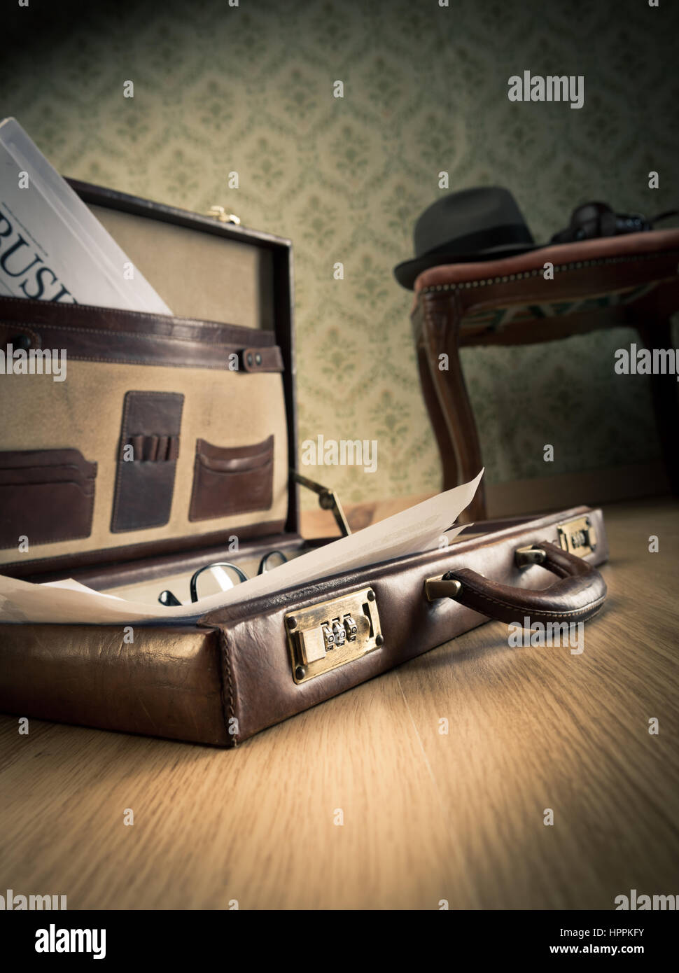 Vintage businessman open briefcase on the floor with financial ...