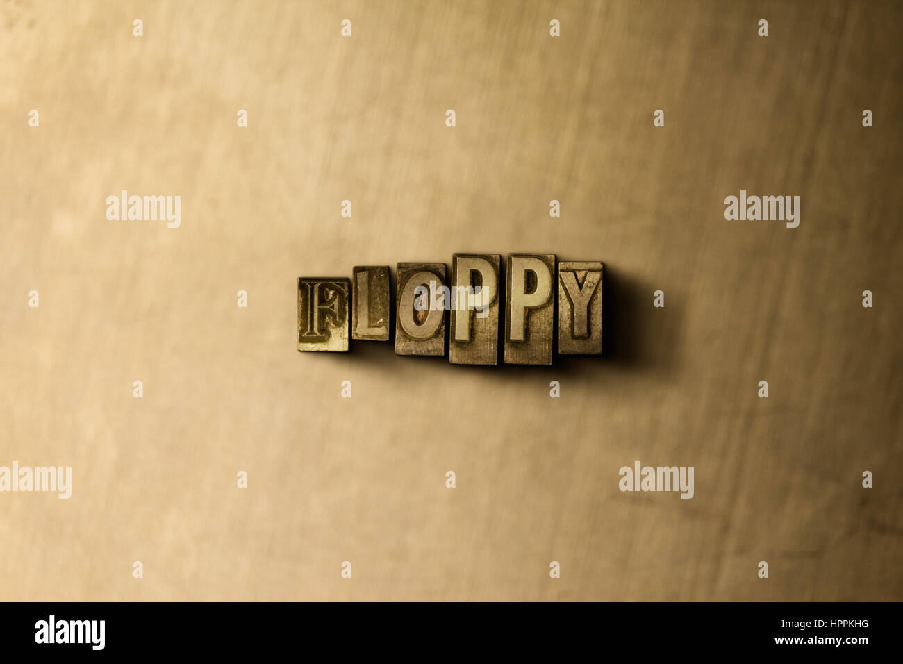 FLOPPY - close-up of grungy vintage typeset word on metal backdrop ...