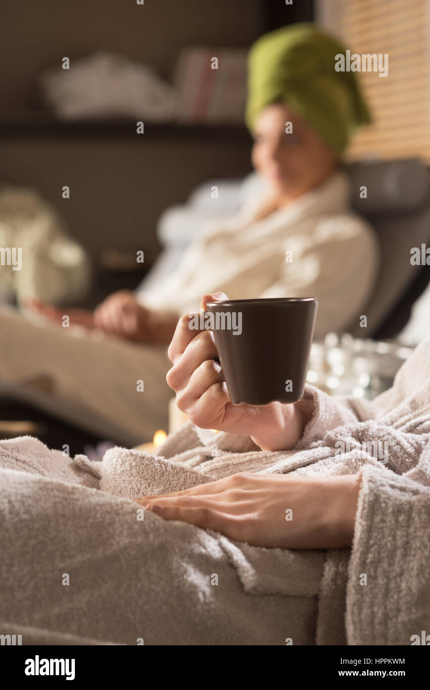 Beautiful women enjoying spa treatments, cup close up Stock Photo - Alamy