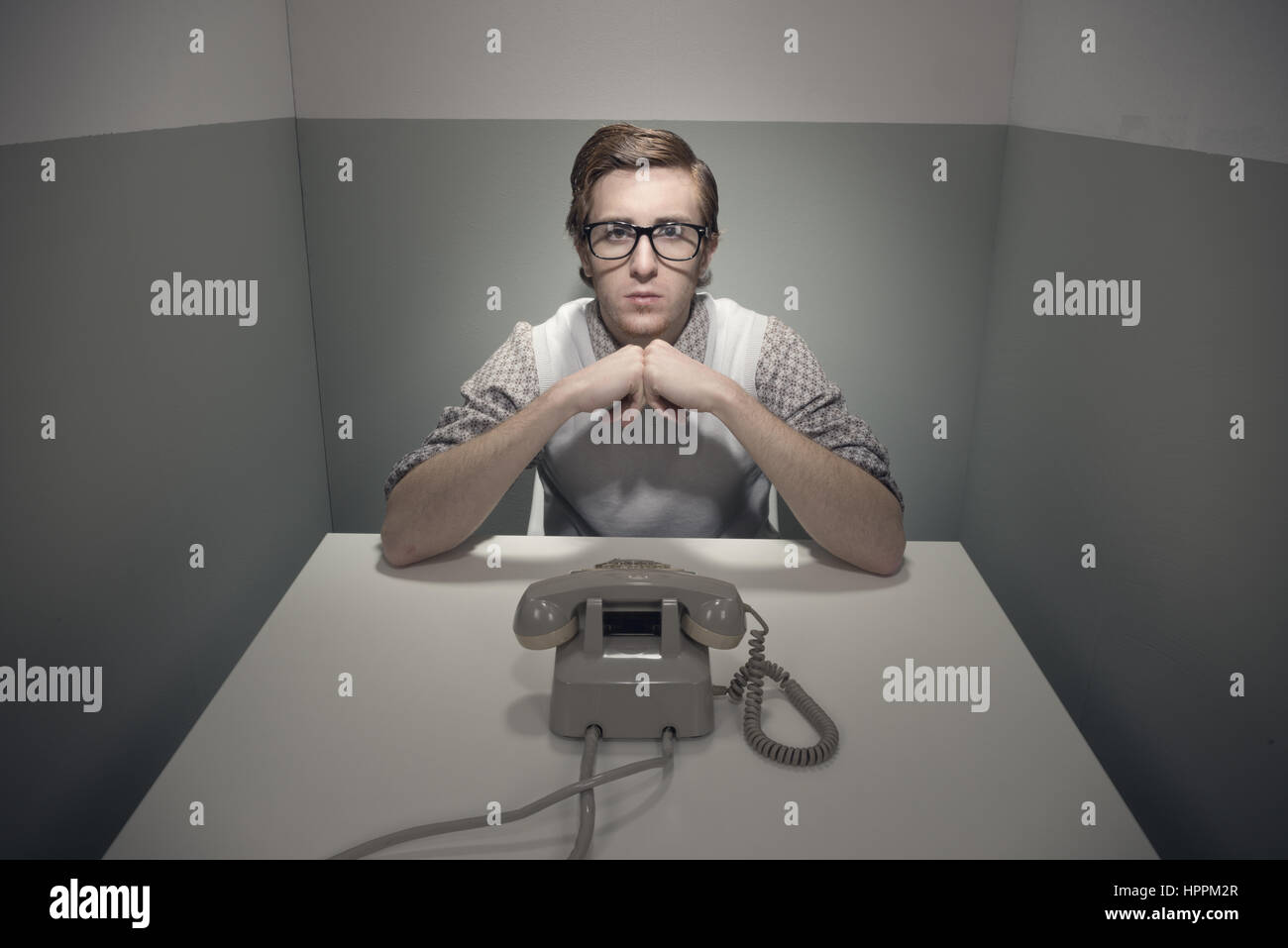 Nerd guy waiting for an important phone call in his small room Stock ...