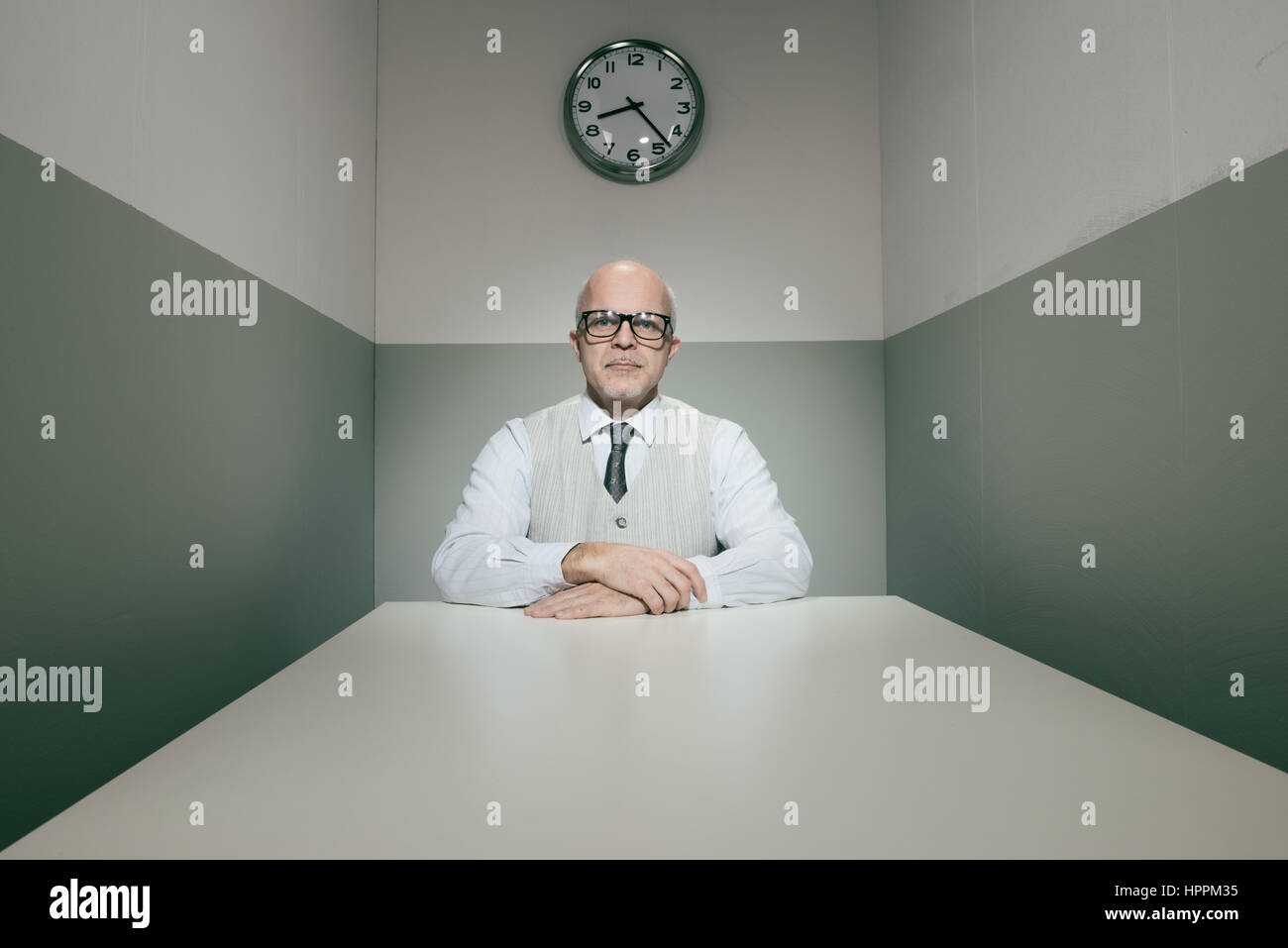 Senior boss examining applicants during job interview Stock Photo - Alamy