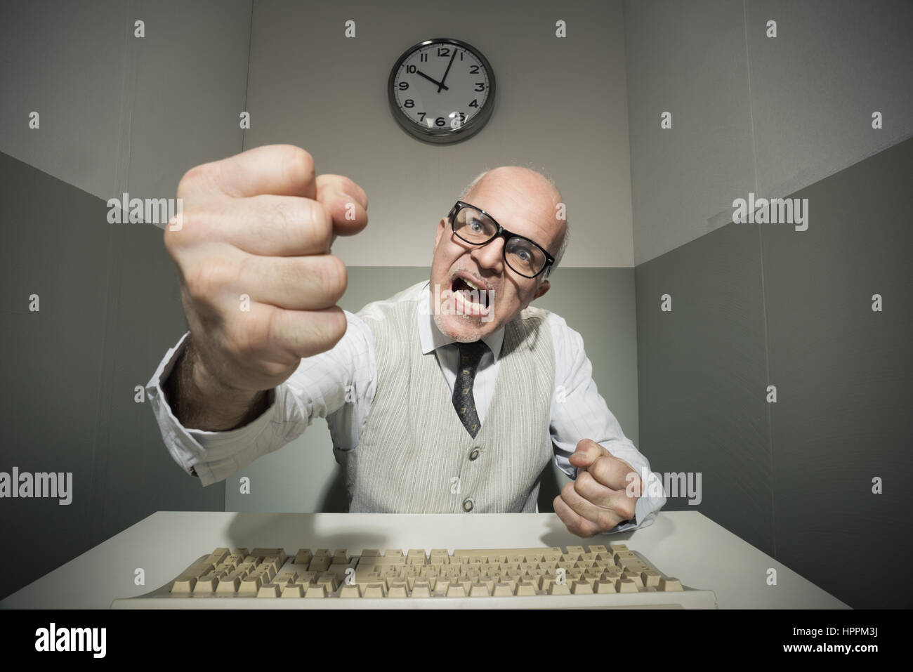Vintage office worker angry and yelling at computer Stock Photo - Alamy