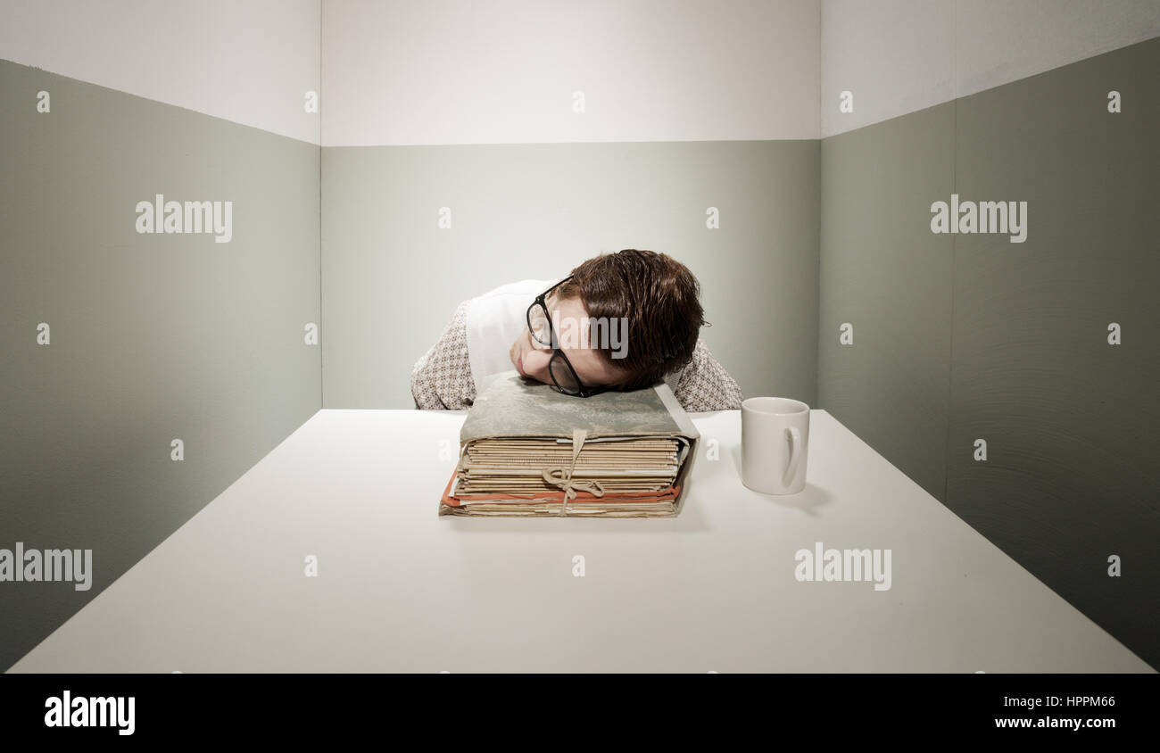 Young nerd guy sleeping on a pile of paperwork Stock Photo - Alamy