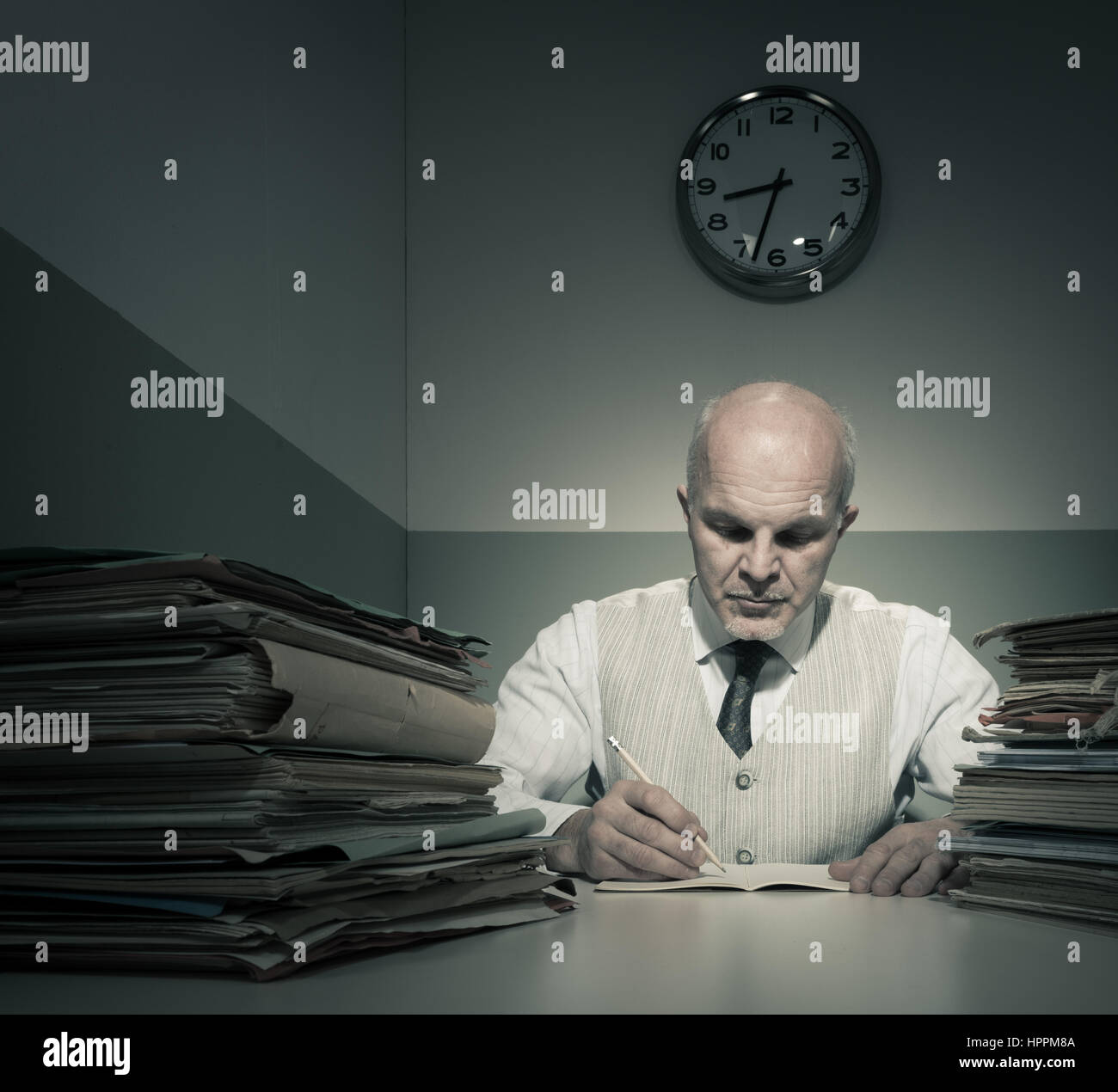 Overworked sad businessman with piles of folders Stock Photo - Alamy