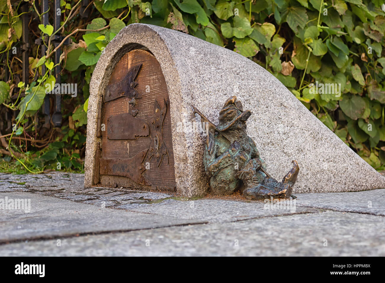 A dwarf, symbol of Wroclaw in Poland guards the entrance of a small ...