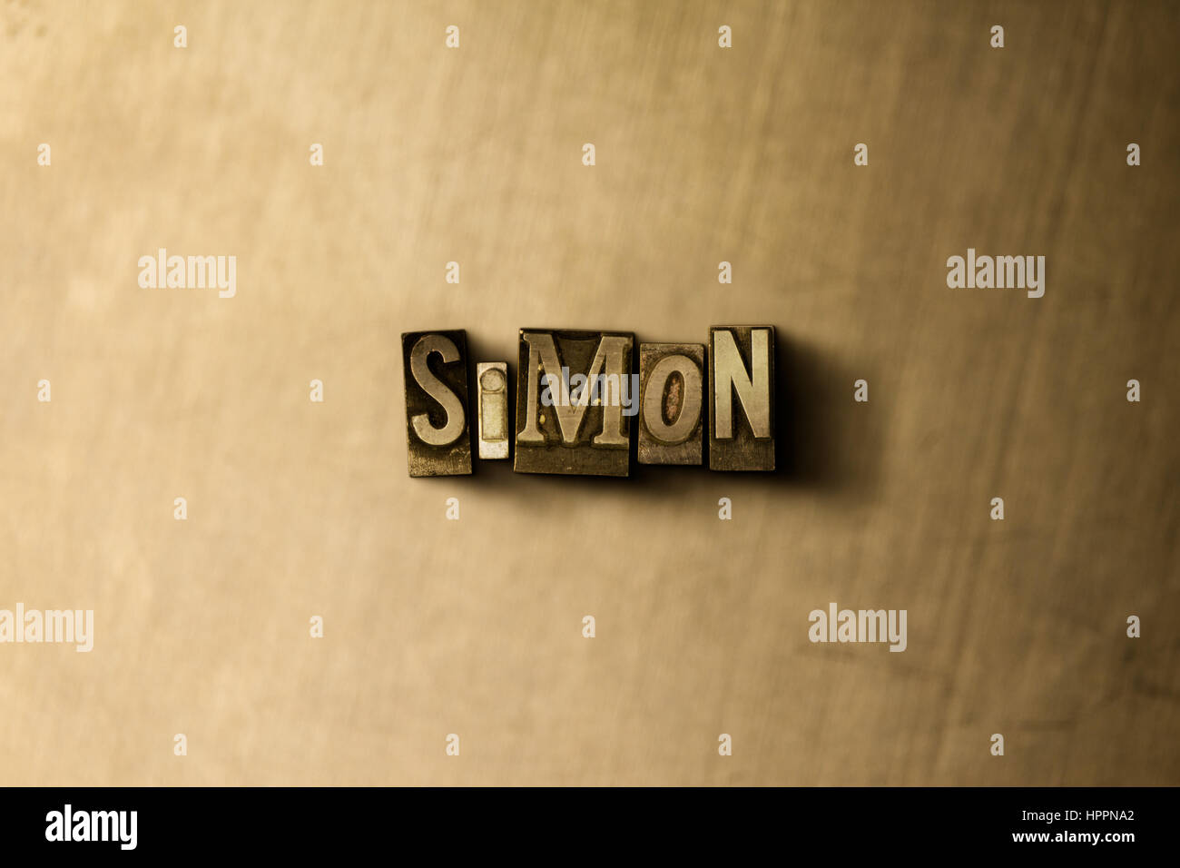 SIMON - close-up of grungy vintage typeset word on metal backdrop ...