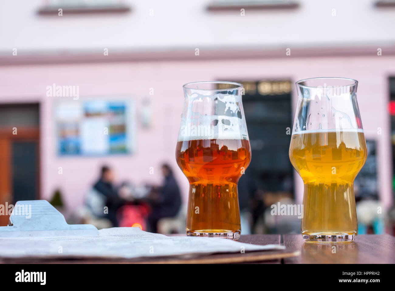 two glasses of beer on table edge outside bar background Stock Photo ...
