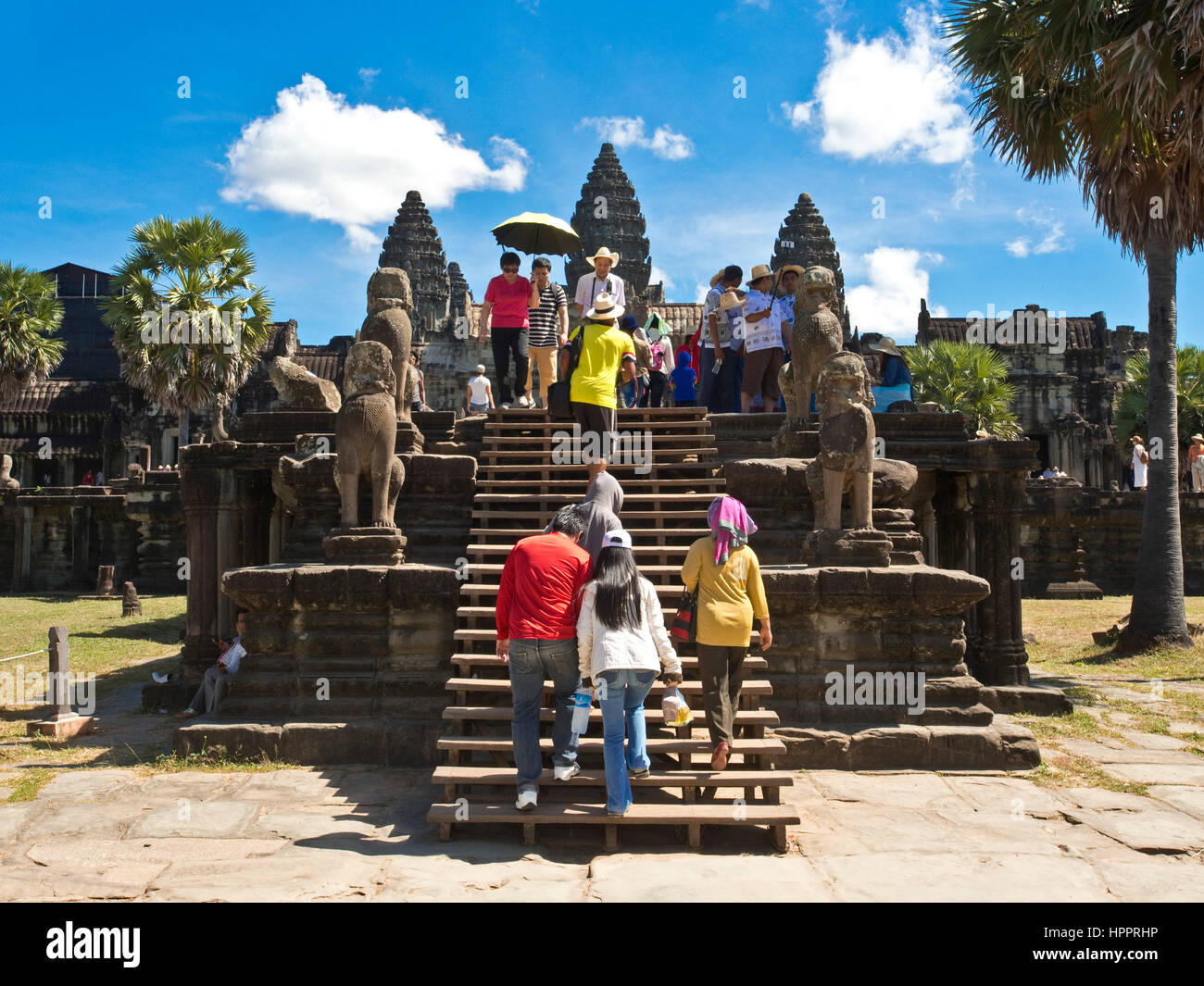 Crowds and groups of tourists walking to or leaving the main entrance ...