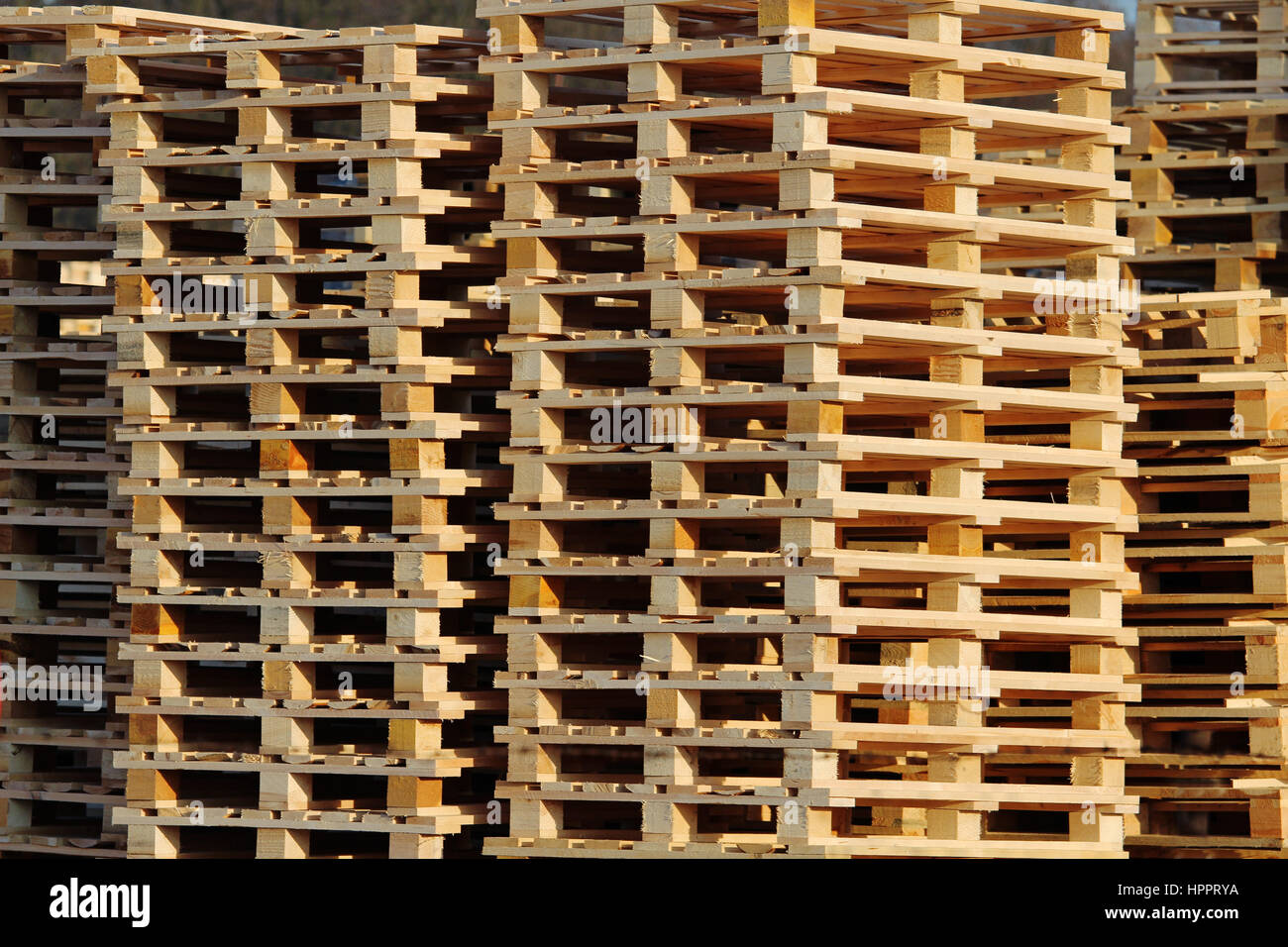 wooden euro pallets on warehouse backyard Stock Photo - Alamy