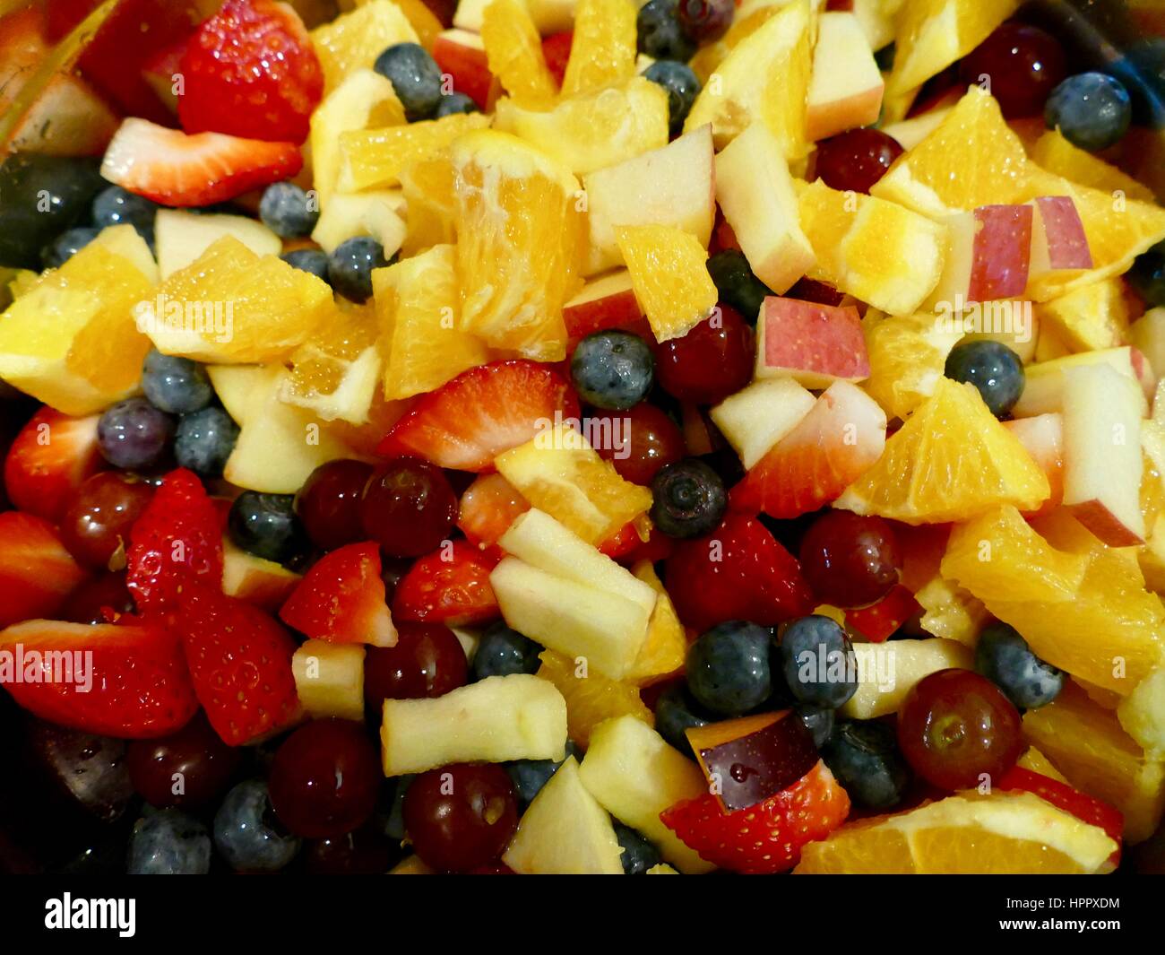Colorful, chopped fruit salad in a large bowl Stock Photo - Alamy