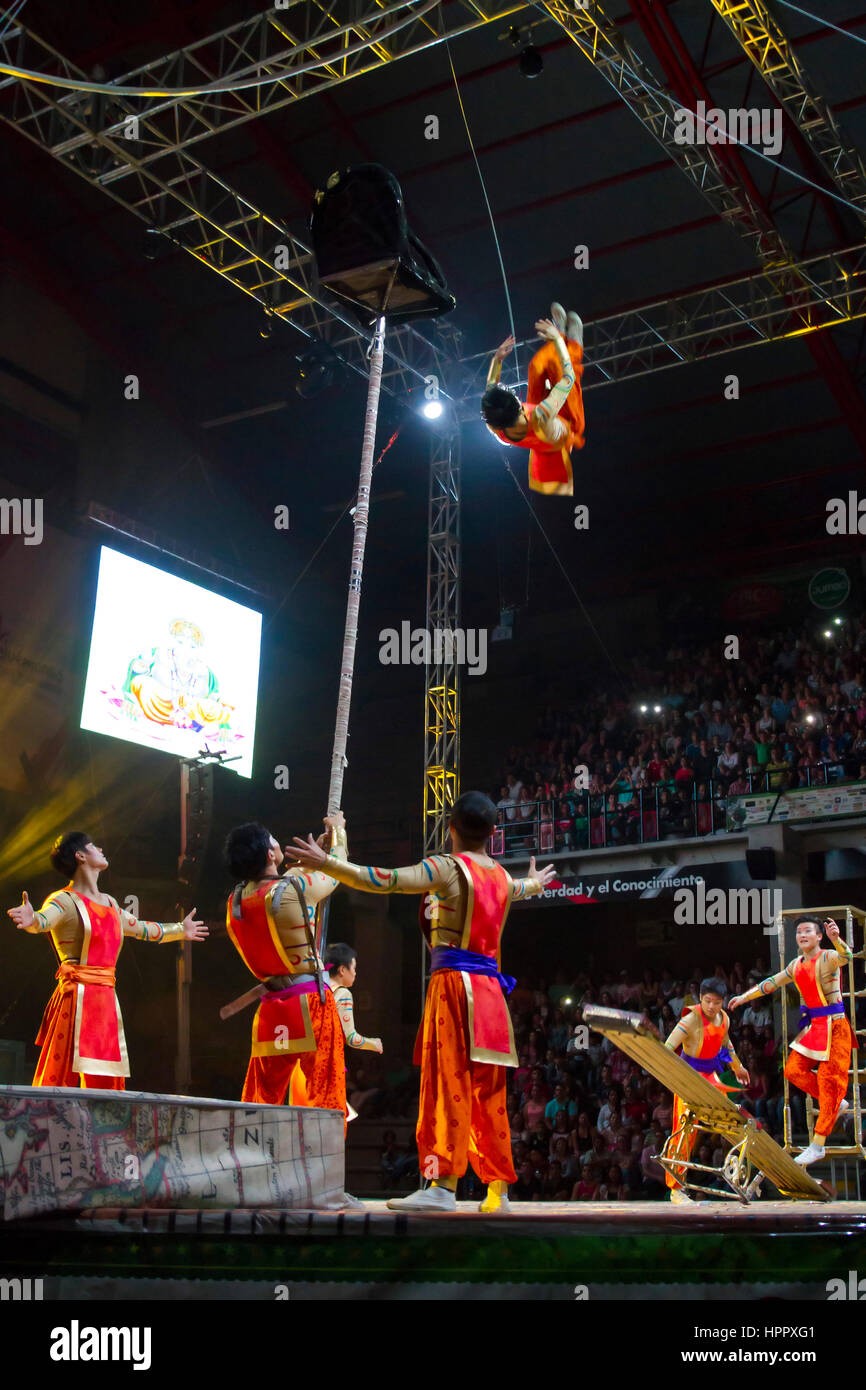 Chinese acrobats in the air after being propelled off a springboard ...